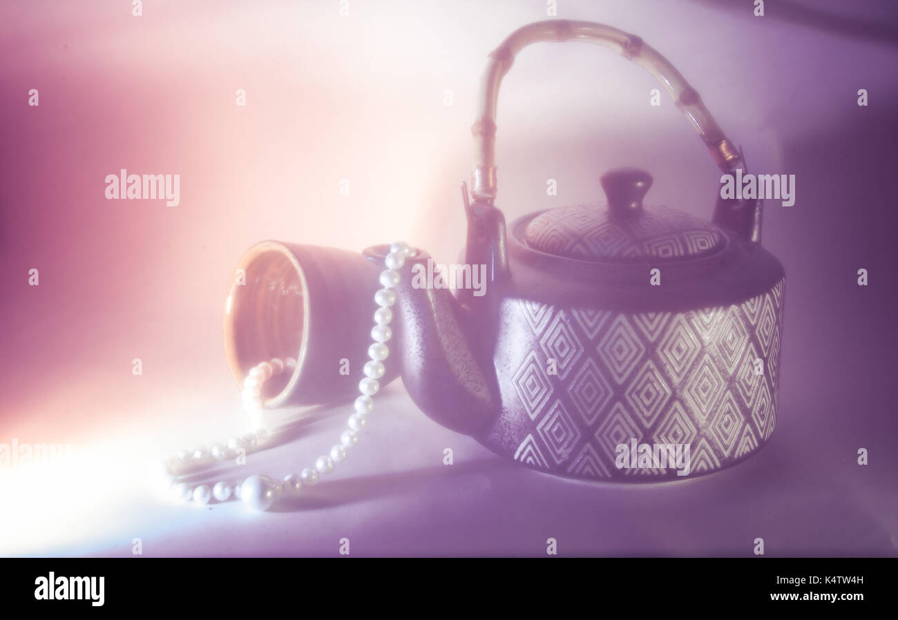 An artistic, extra soft still life with a teapot and cup in beautiful ...