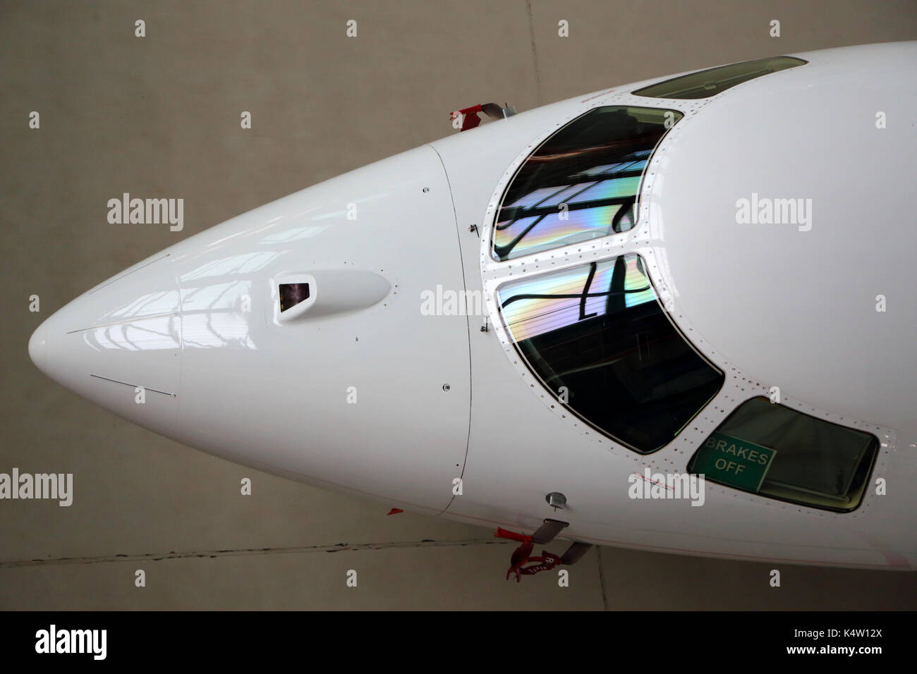 Business jet airplane cockpit glass and nose fairing Stock Photo - Alamy