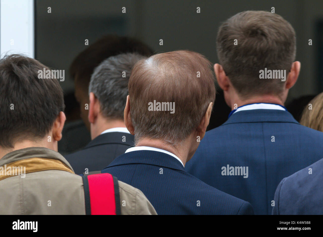 Crowd - queue of people near enter to conference - businessmen, rear ...