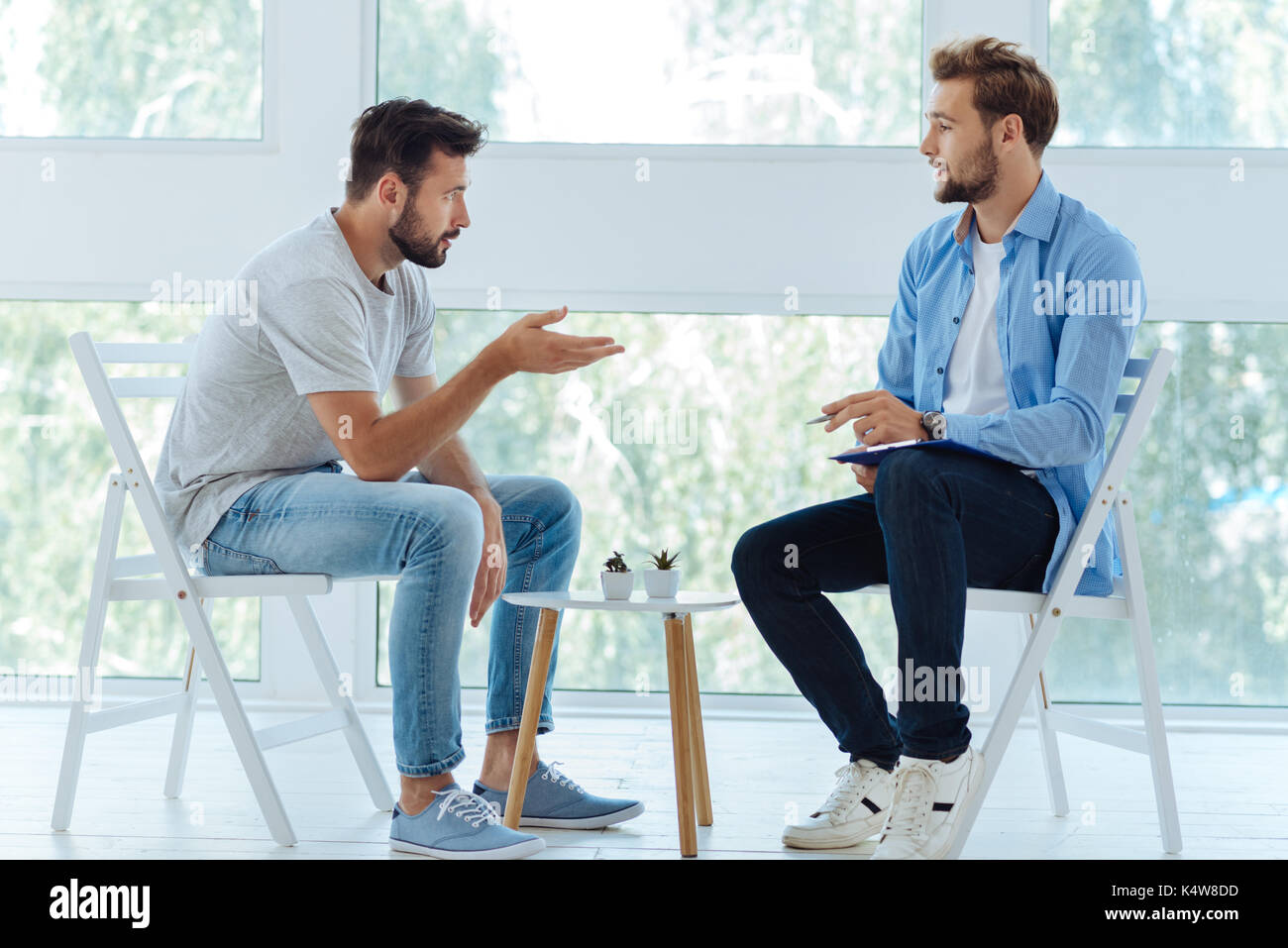 Men talk problems hi-res stock photography and images - Alamy