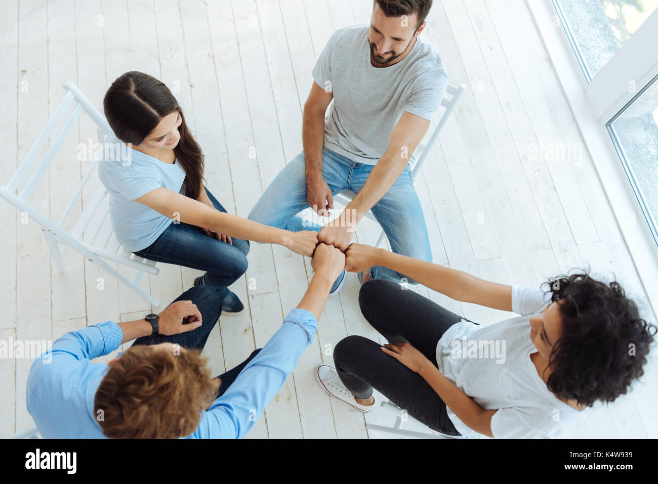 Top view of positive delighted people sitting in the circle Stock Photo ...