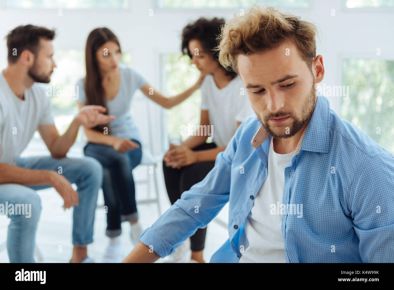 Cheerless young man feeling bad Stock Photo - Alamy