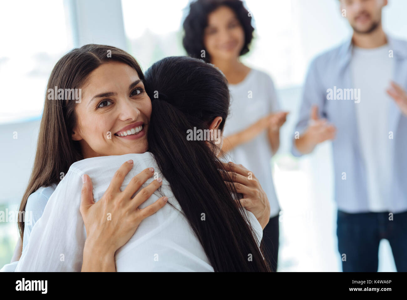Happy delighted woman smiling Stock Photo - Alamy