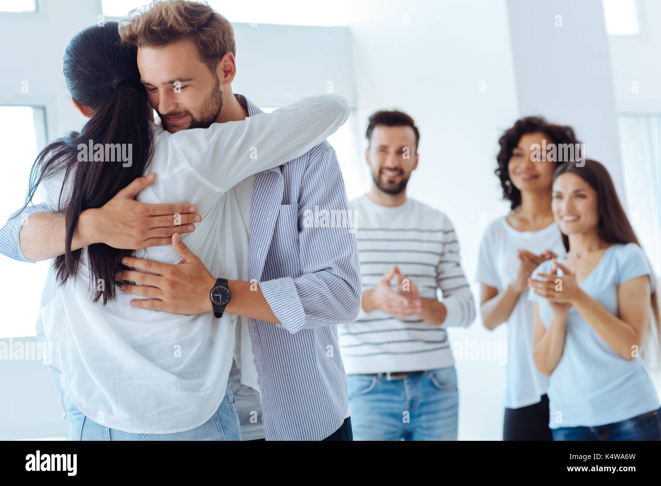 Cheerful delighted people standing together Stock Photo - Alamy