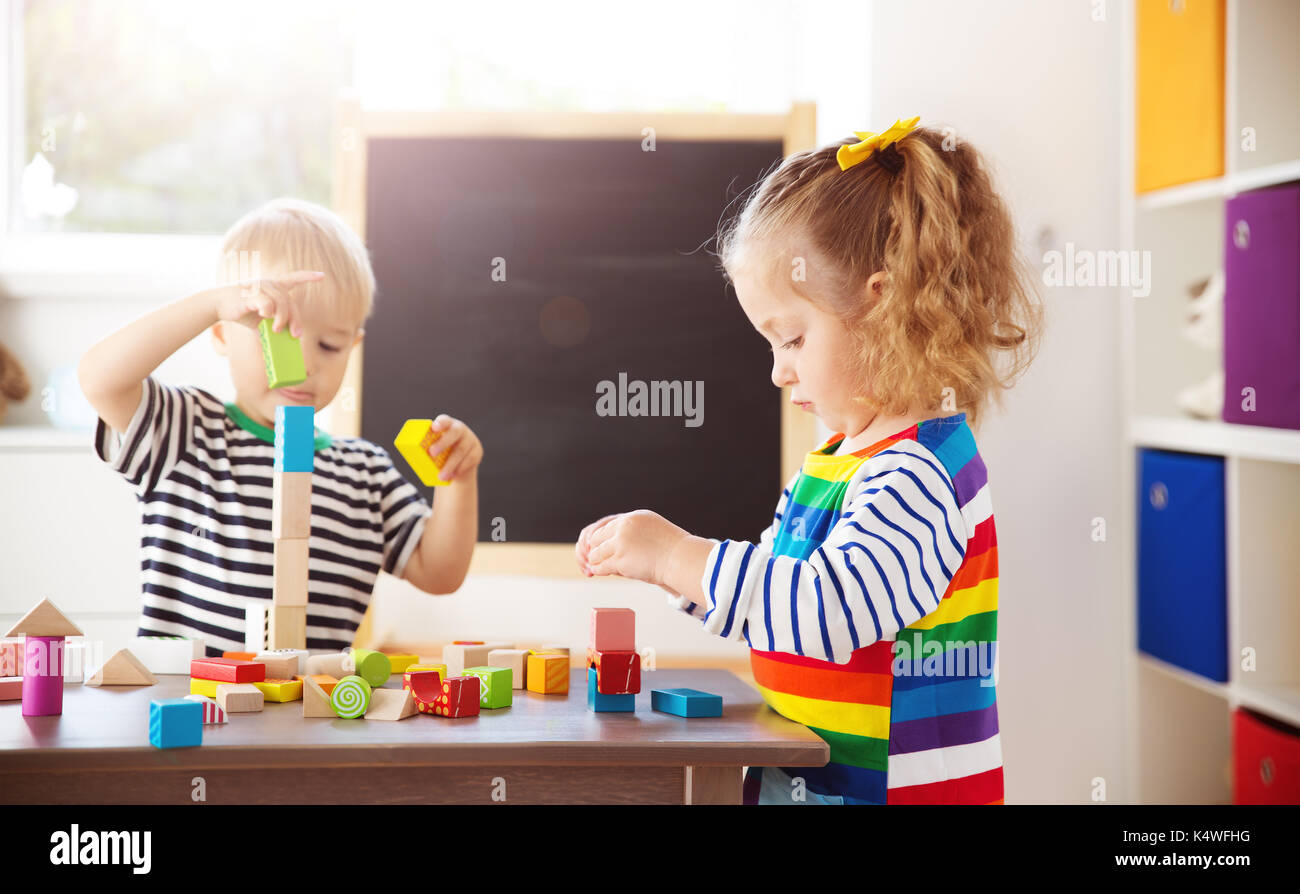 Little child playing with blocks Stock Photo - Alamy