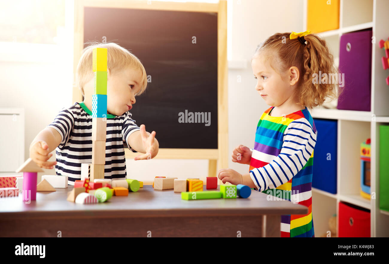 Little child playing with blocks Stock Photo - Alamy
