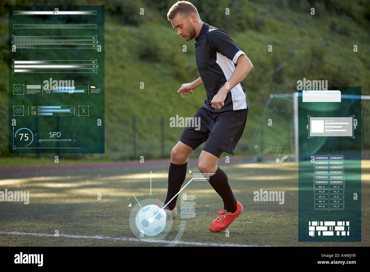 soccer player playing with ball on football field Stock Photo - Alamy