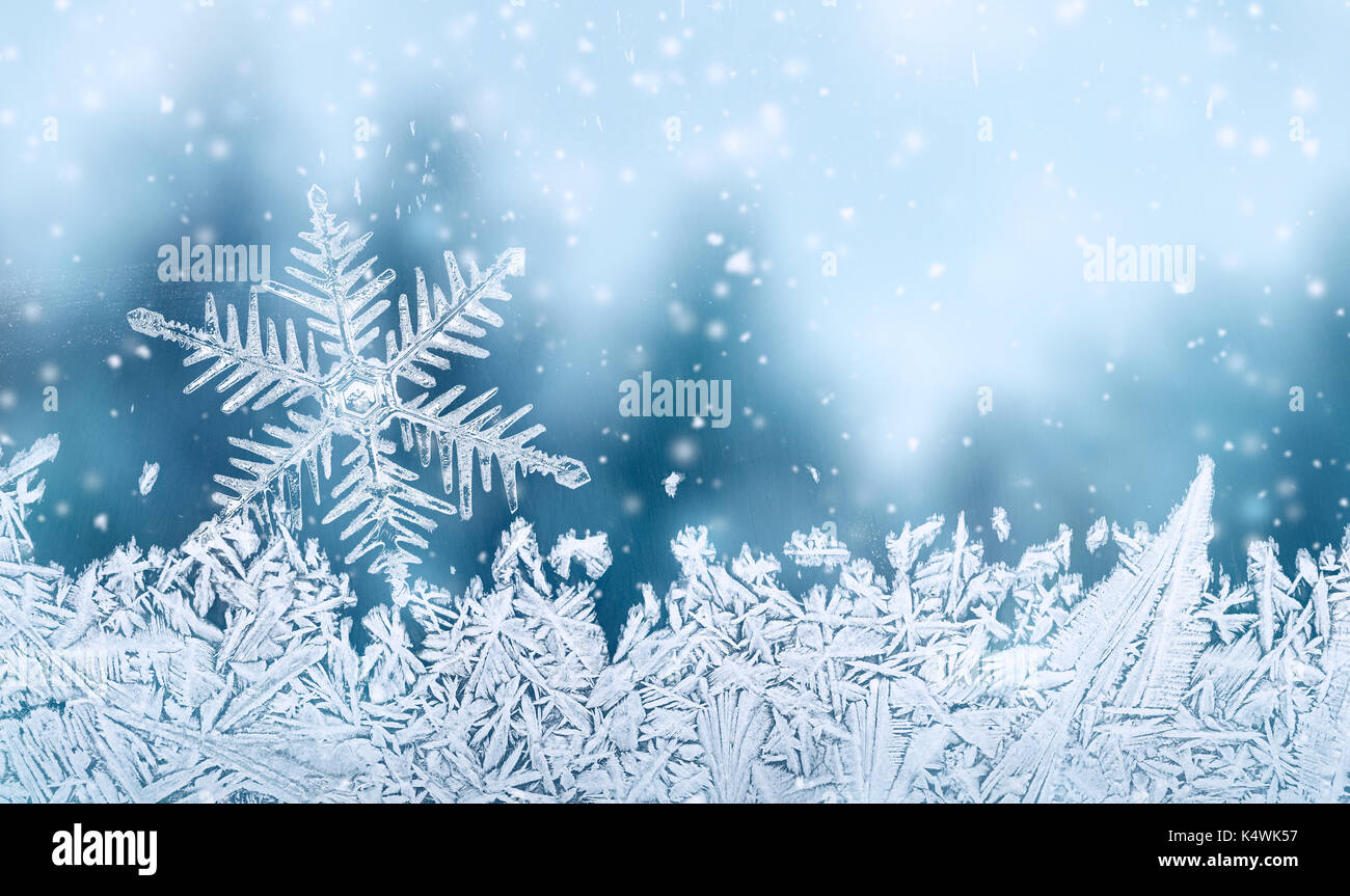 Snowflake and snow crystal on window Stock Photo - Alamy