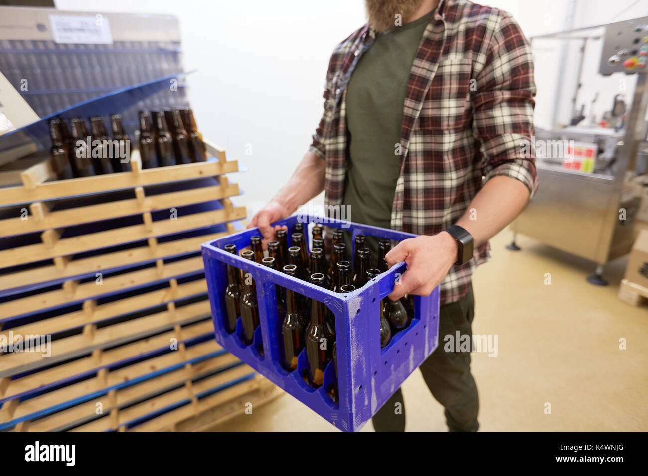 Man carrying bottles hi-res stock photography and images - Alamy