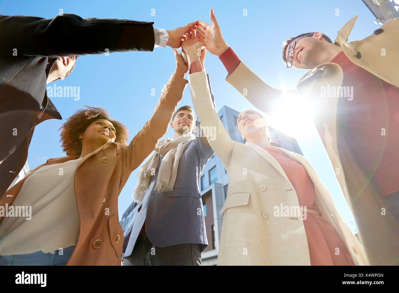 group of happy people making high five in city Stock Photo - Alamy group of happy people making high five in city Stock Photo - Alamy