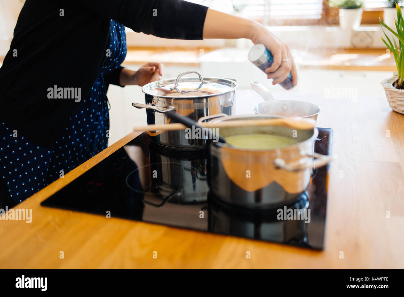 Woman adding spices to the pot hi-res stock photography and images - Alamy