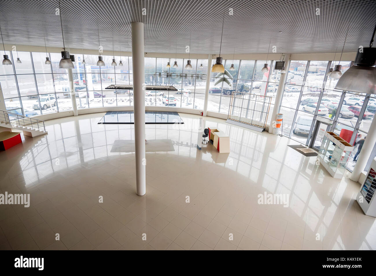 Interior of empty car dealership Stock Photo - Alamy