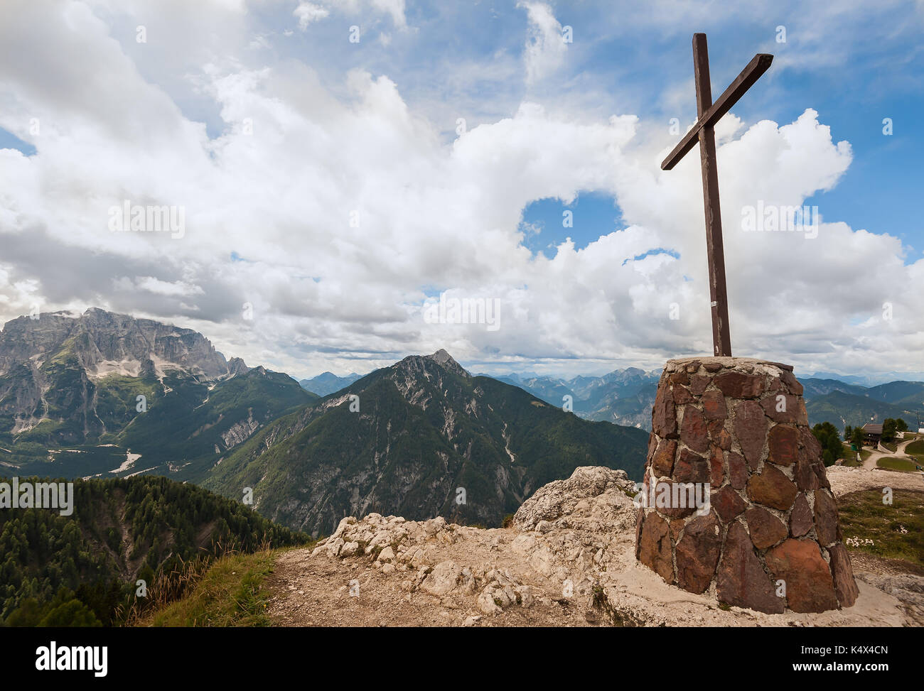 Wooden cross on top of the mountain. Mountain landscape above the ...
