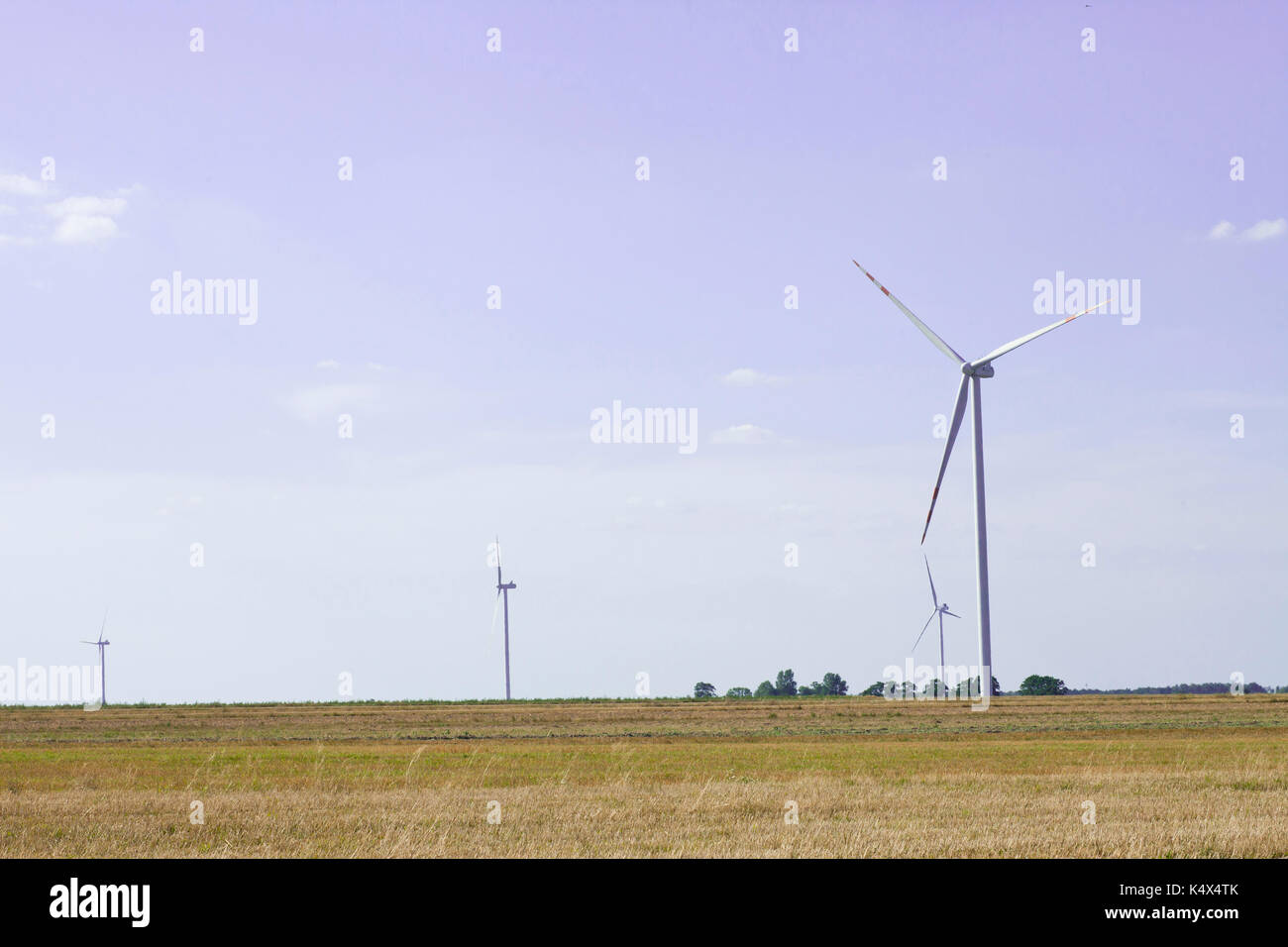 Wind turbines farm making renewable energy Stock Photo - Alamy