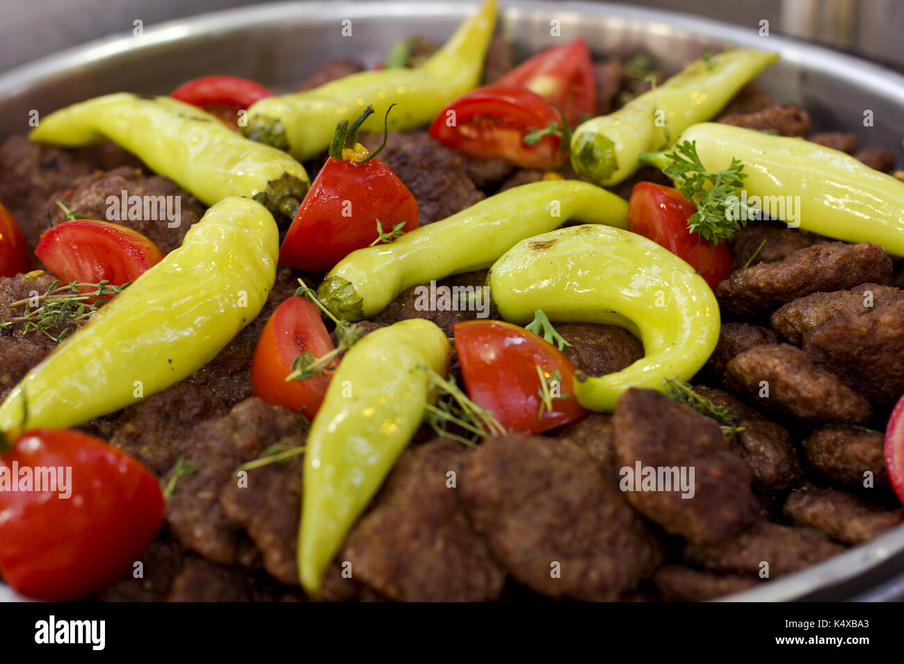 Beef cutlets baked on the grill with vegetables and sweet peppers and ...