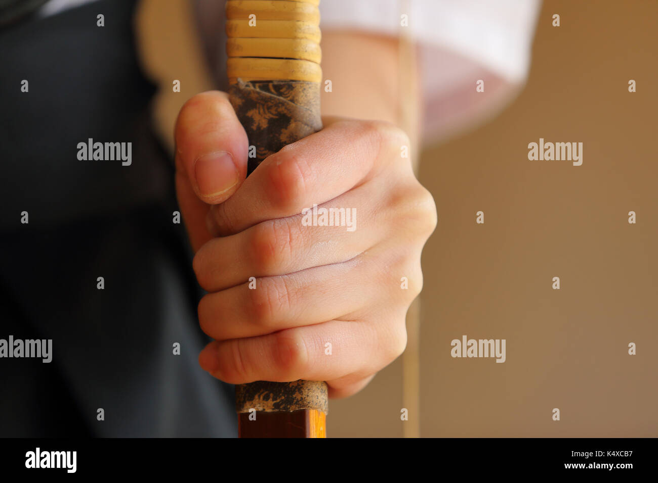 Japanese traditional archery athlete hand holding bow Stock Photo - Alamy