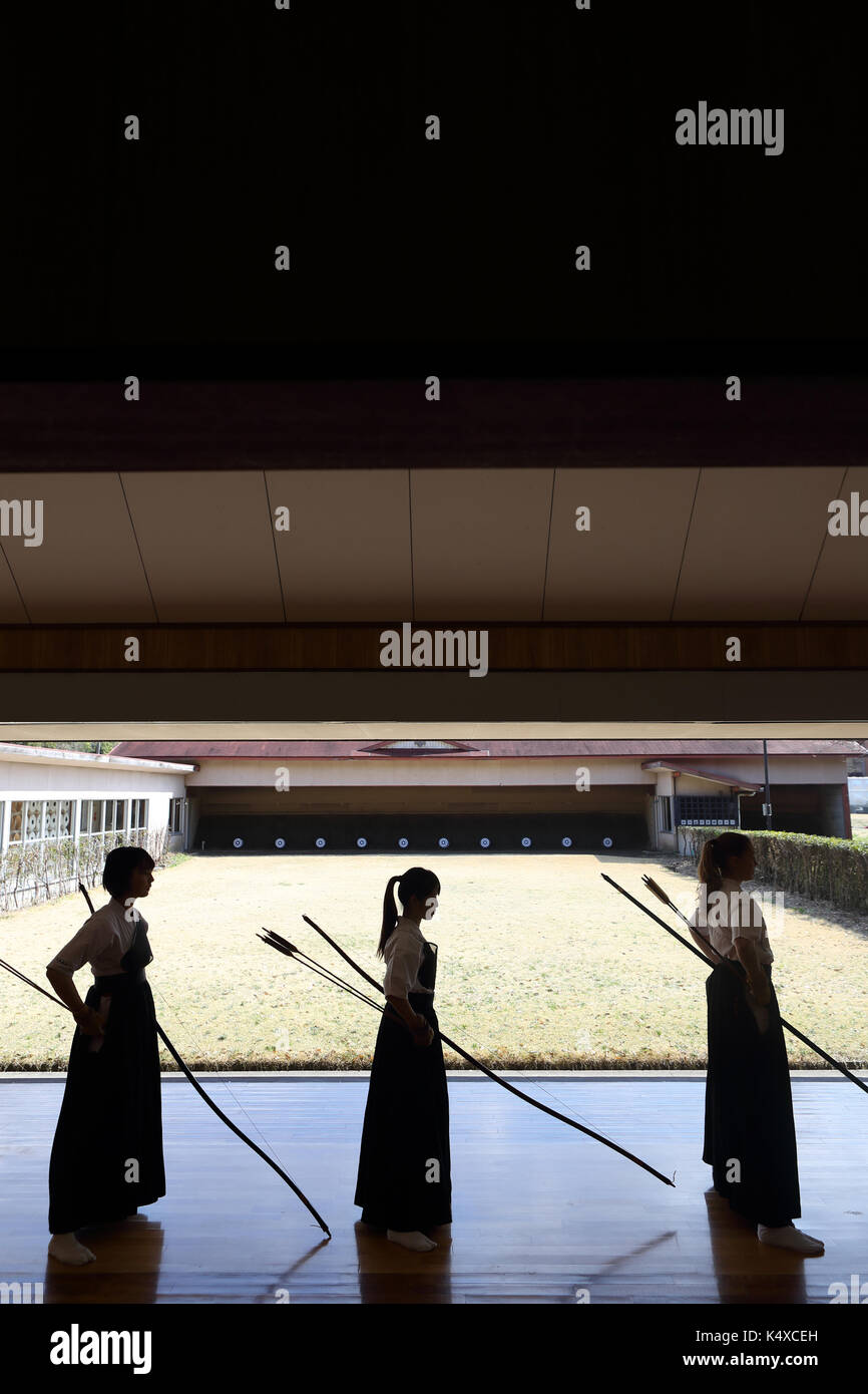 Multi-ethnic group of traditional archery athletes practicing Stock ...