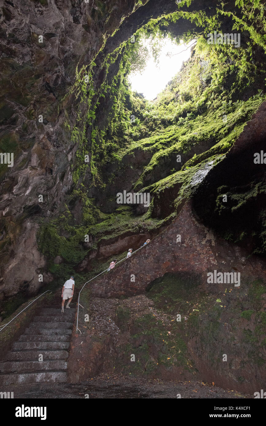 People visiting Gruta do Carvao lava tube cave, Algar do Carvao ...