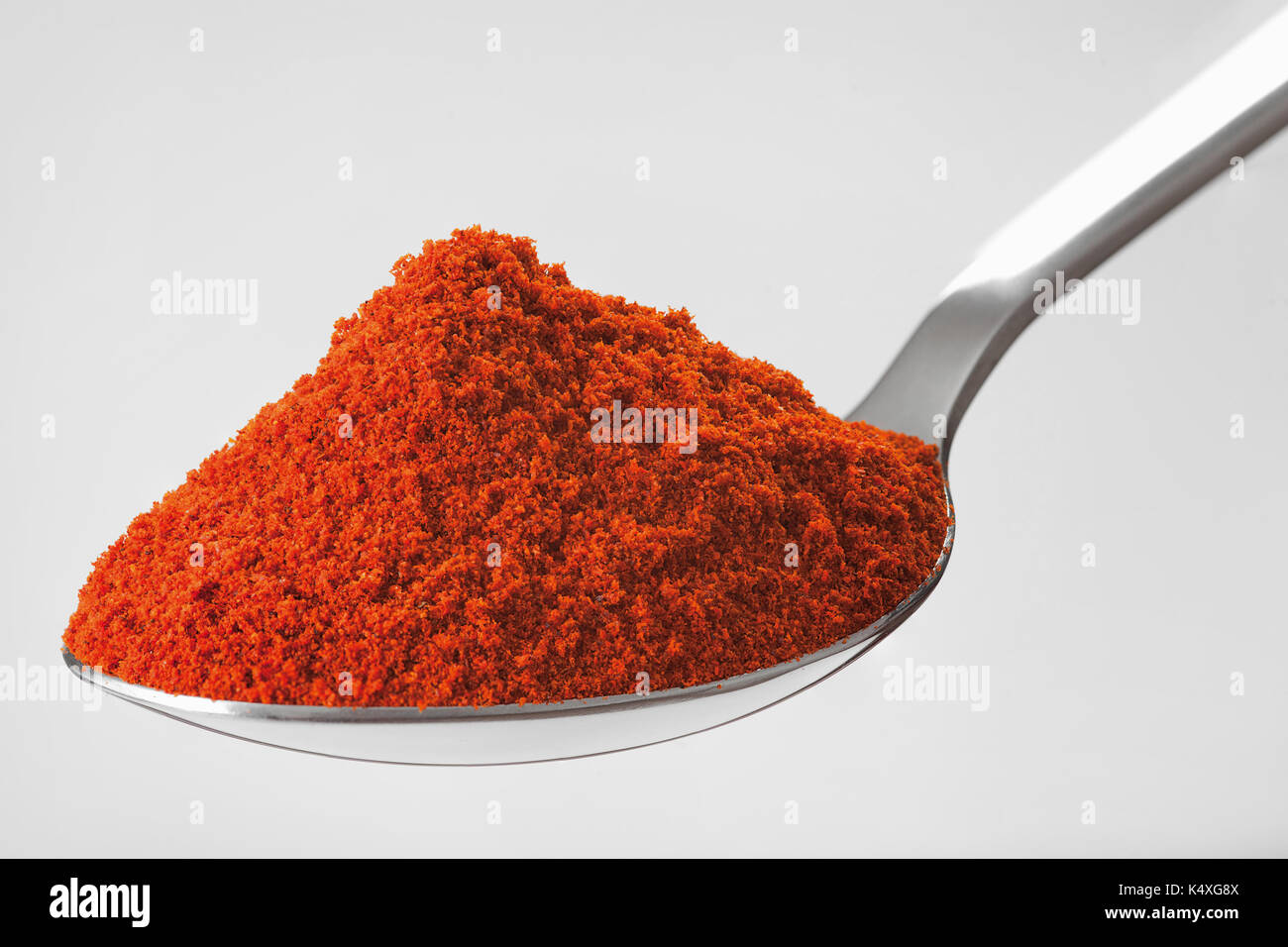 White pepper and chili powder in spoon hi-res stock photography and ...