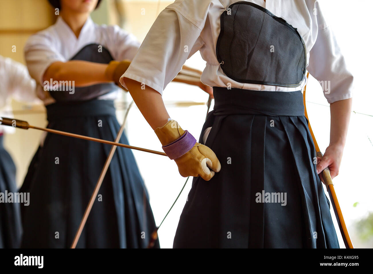 Multi-ethnic group of traditional archery athletes practicing Stock ...