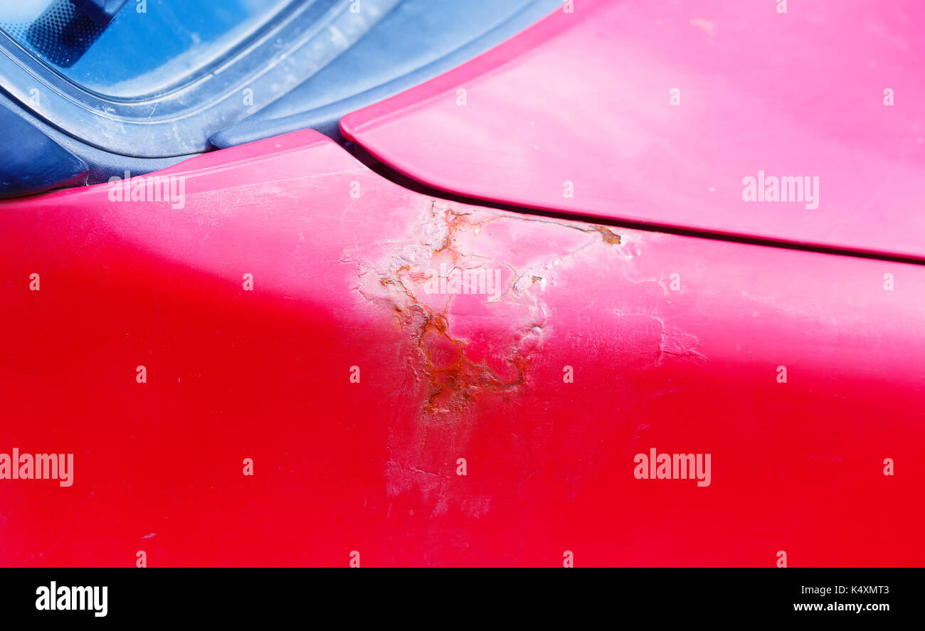 texture background rust on the hood of the car, Red car Stock Photo - Alamy