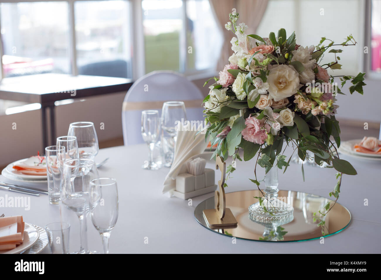 Wedding decor. Flowers in the restaurant, table setting Stock Photo - Alamy
