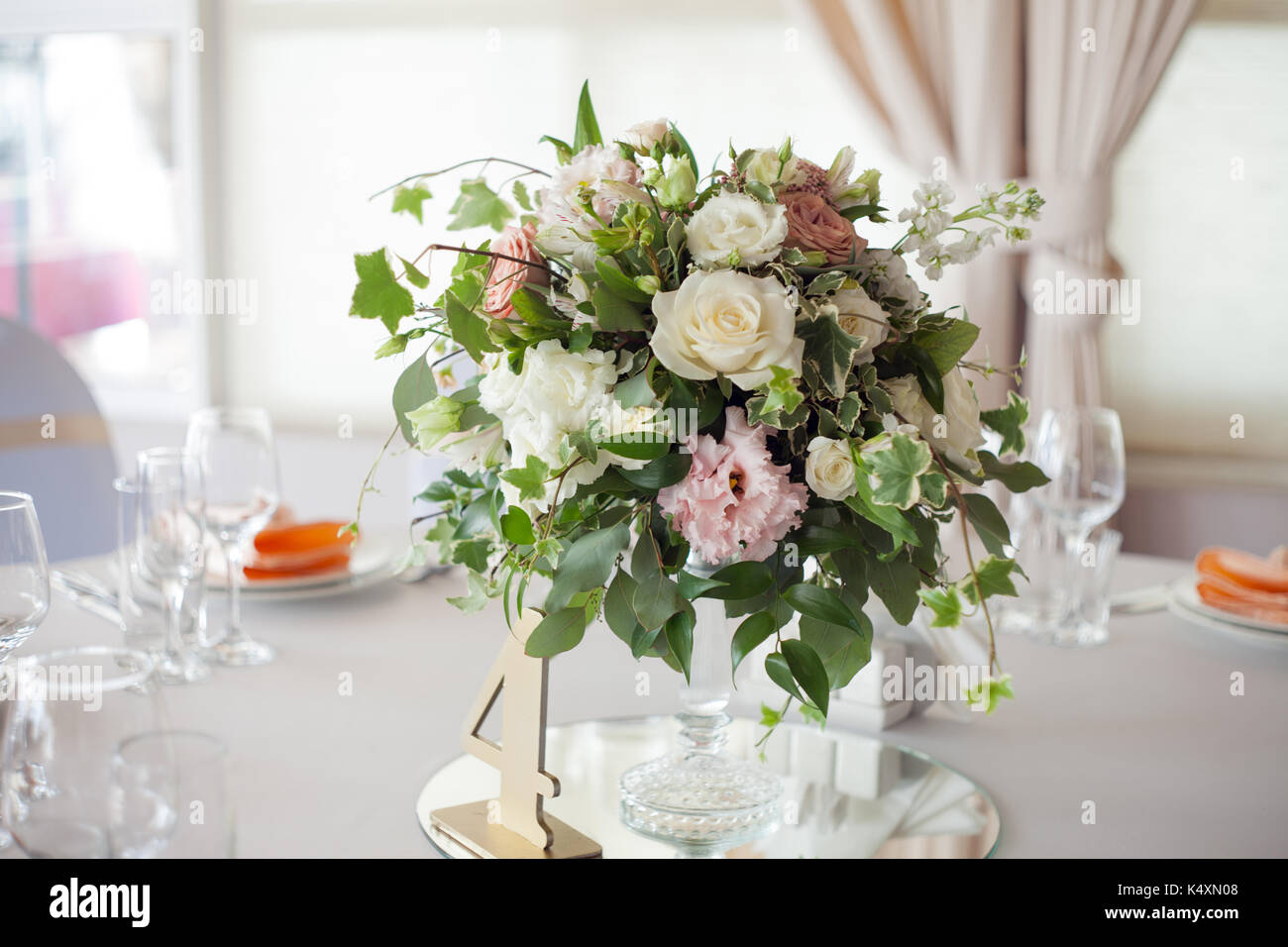 Wedding decor. Flowers in the restaurant, table setting Stock Photo - Alamy