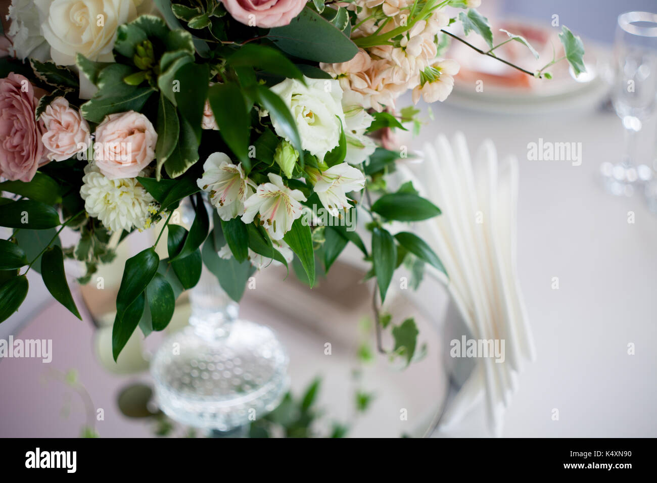 Wedding decor. Flowers in the restaurant, table setting Stock Photo - Alamy