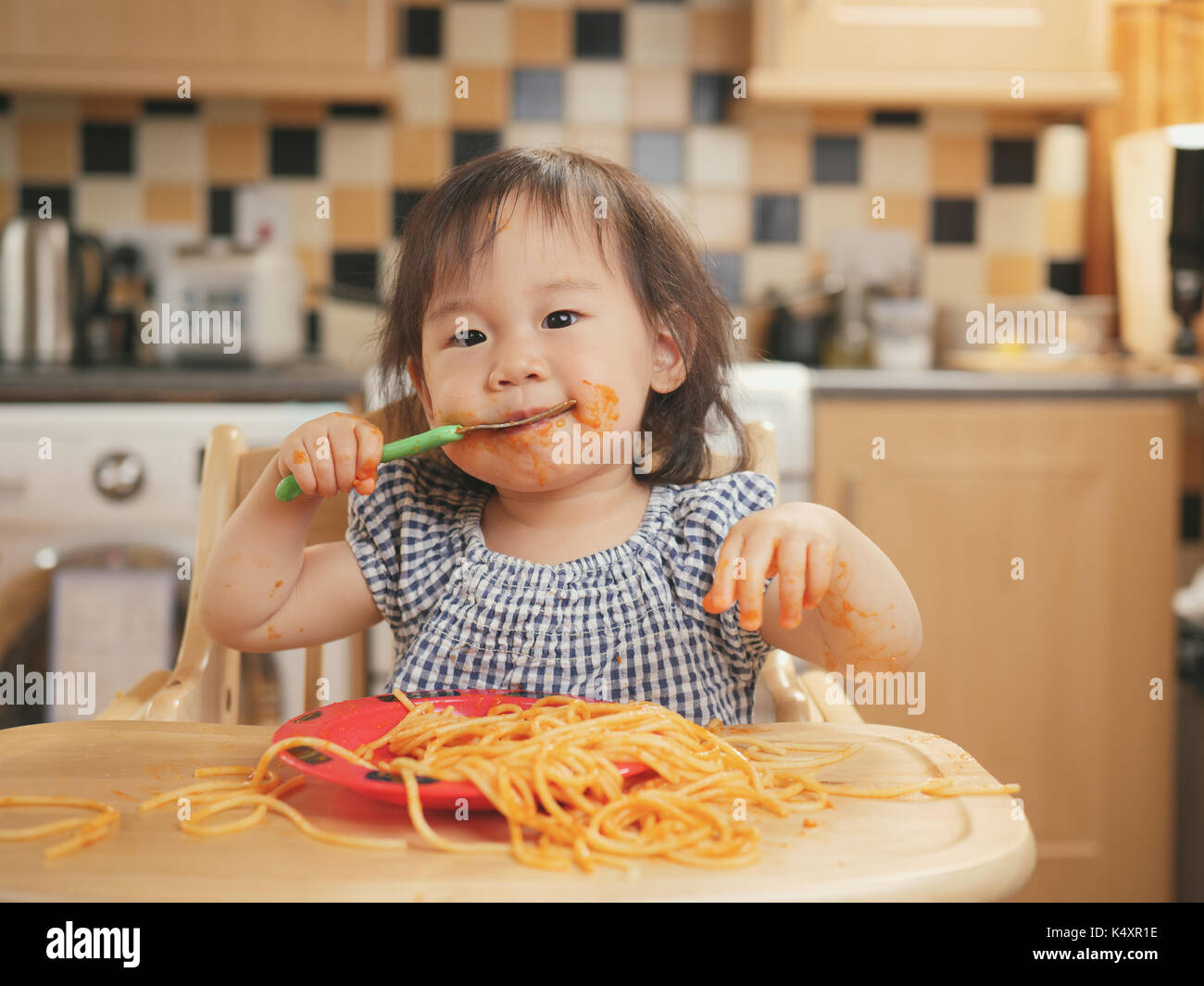 Asian baby eating noodles hi-res stock photography and images - Alamy