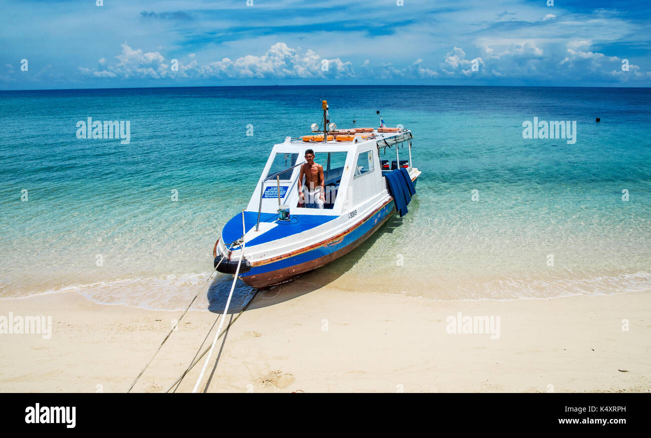 SELINGAN, MALAYSIA - MAY 08: An unidentified man on his boat to ...