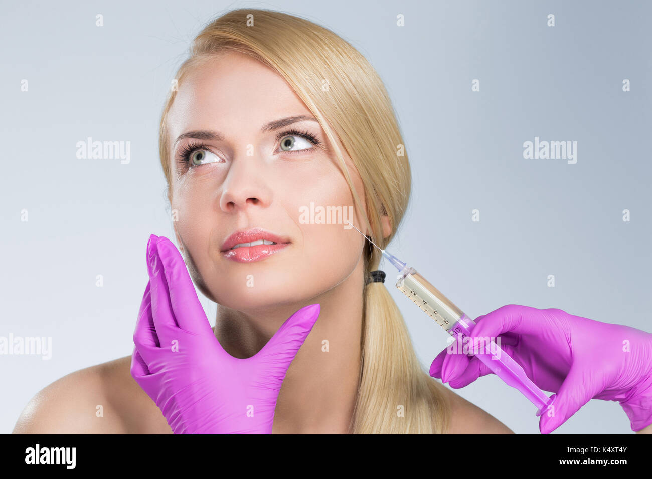 Close up portrait of beautiful woman getting injection on face Stock ...