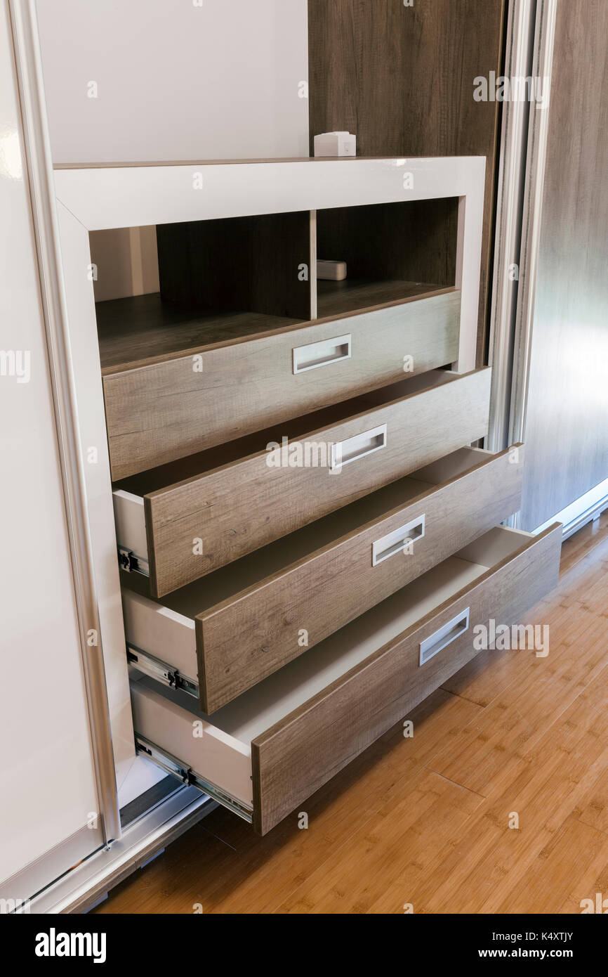 open wooden drawers in the closet, close up Stock Photo - Alamy