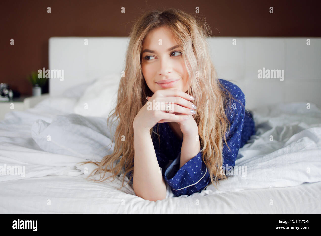 Cheerful morning. Portrait of charming girl in the bedroom Stock Photo ...