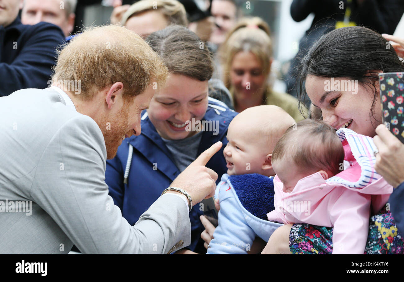 Prince Harry meets Emma Mason (second left) and her seven month old son ...