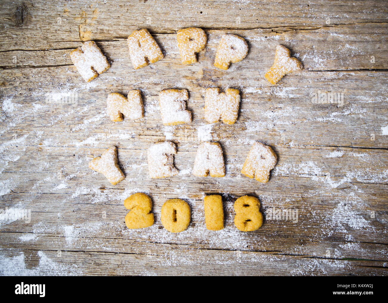 Happy new year note written with cookie letters Stock Photo - Alamy