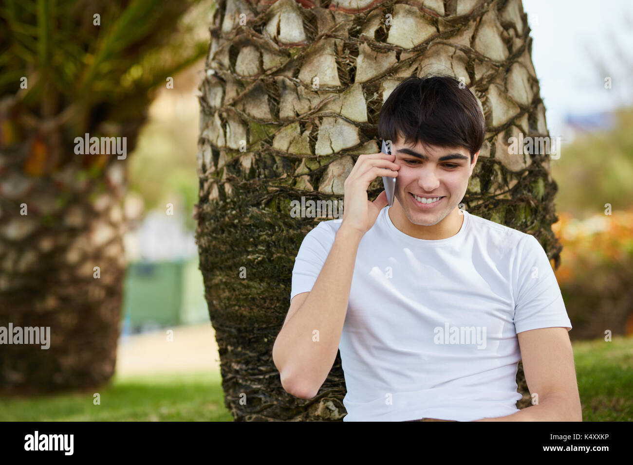 Man sitting under tree hi-res stock photography and images - Alamy