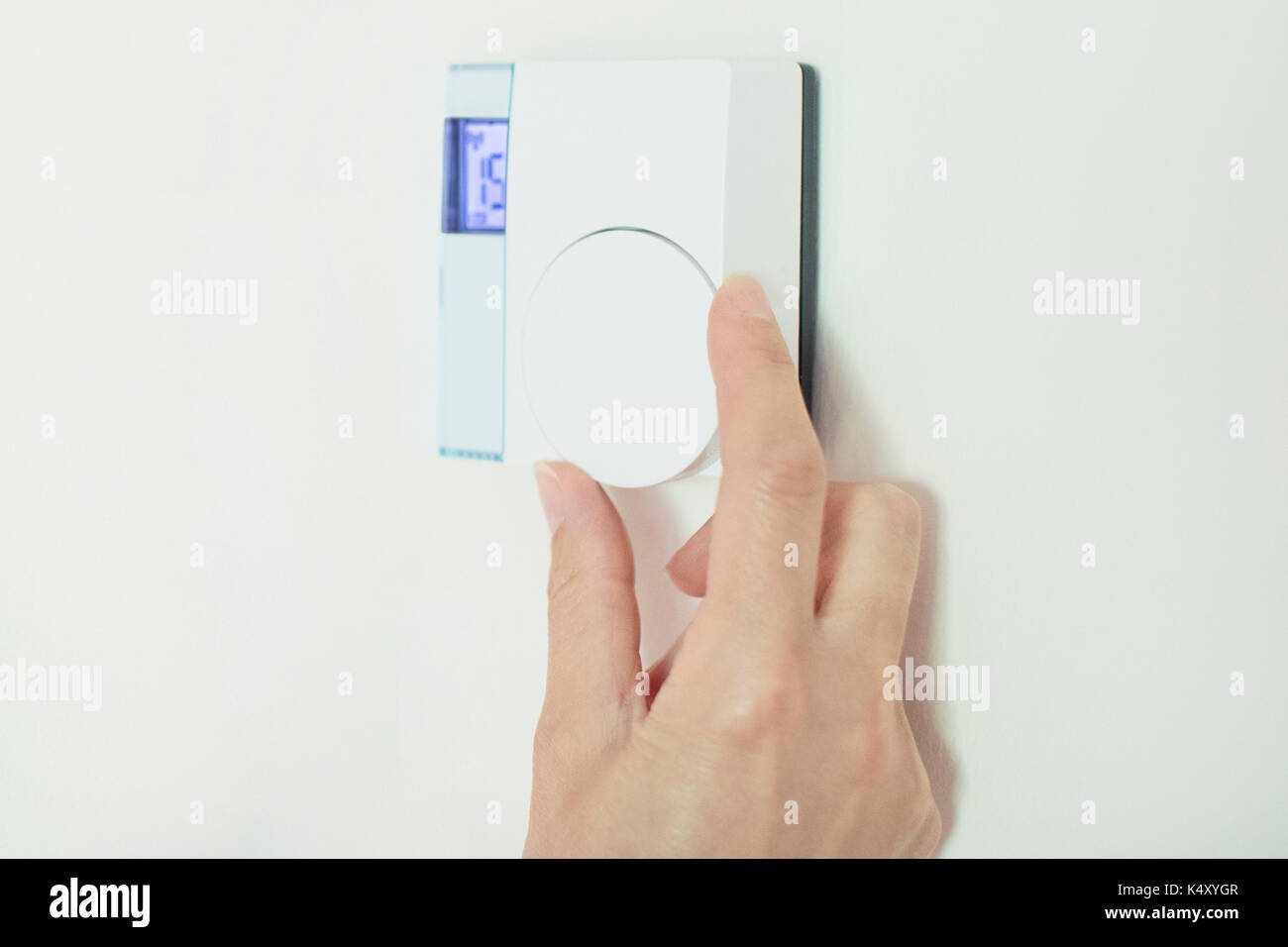 Hand on central heating hi-res stock photography and images - Alamy