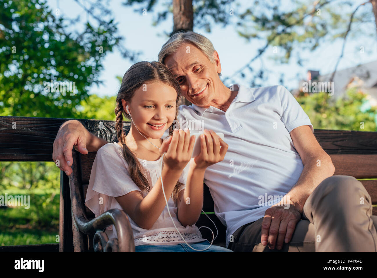family using smartphone Stock Photo - Alamy