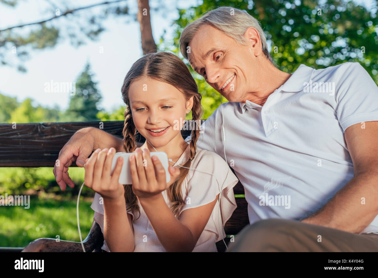family using smartphone Stock Photo - Alamy