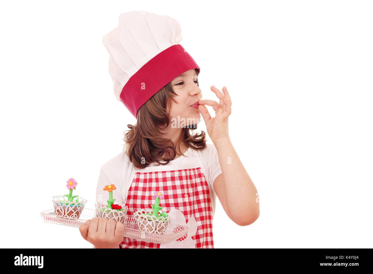 happy little girl cook with sweet muffin Stock Photo - Alamy