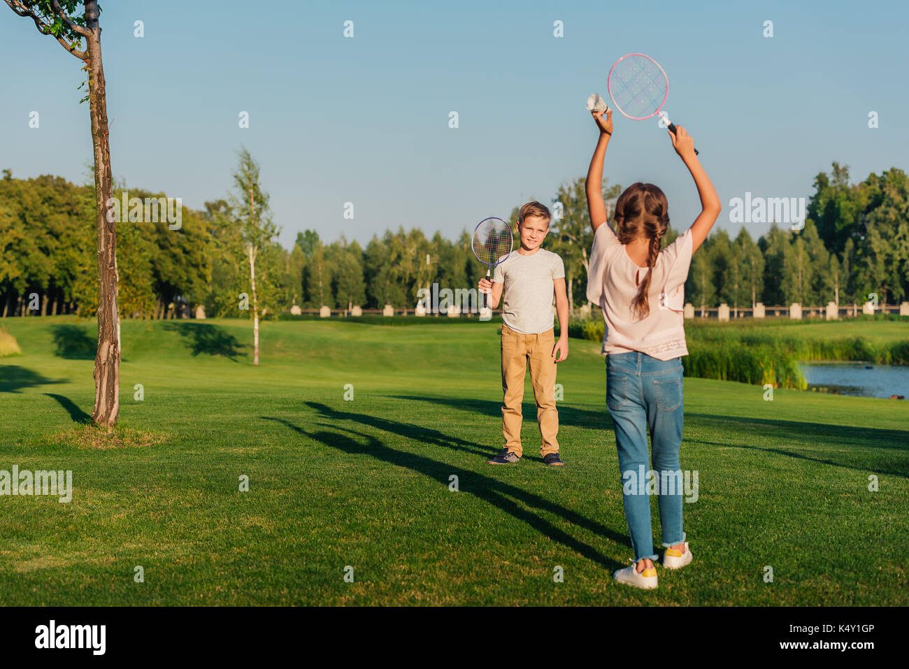children playing badminton Stock Photo - Alamy