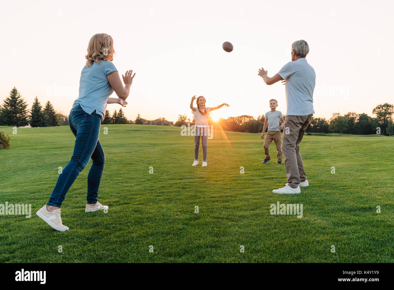family playing american football Stock Photo - Alamy