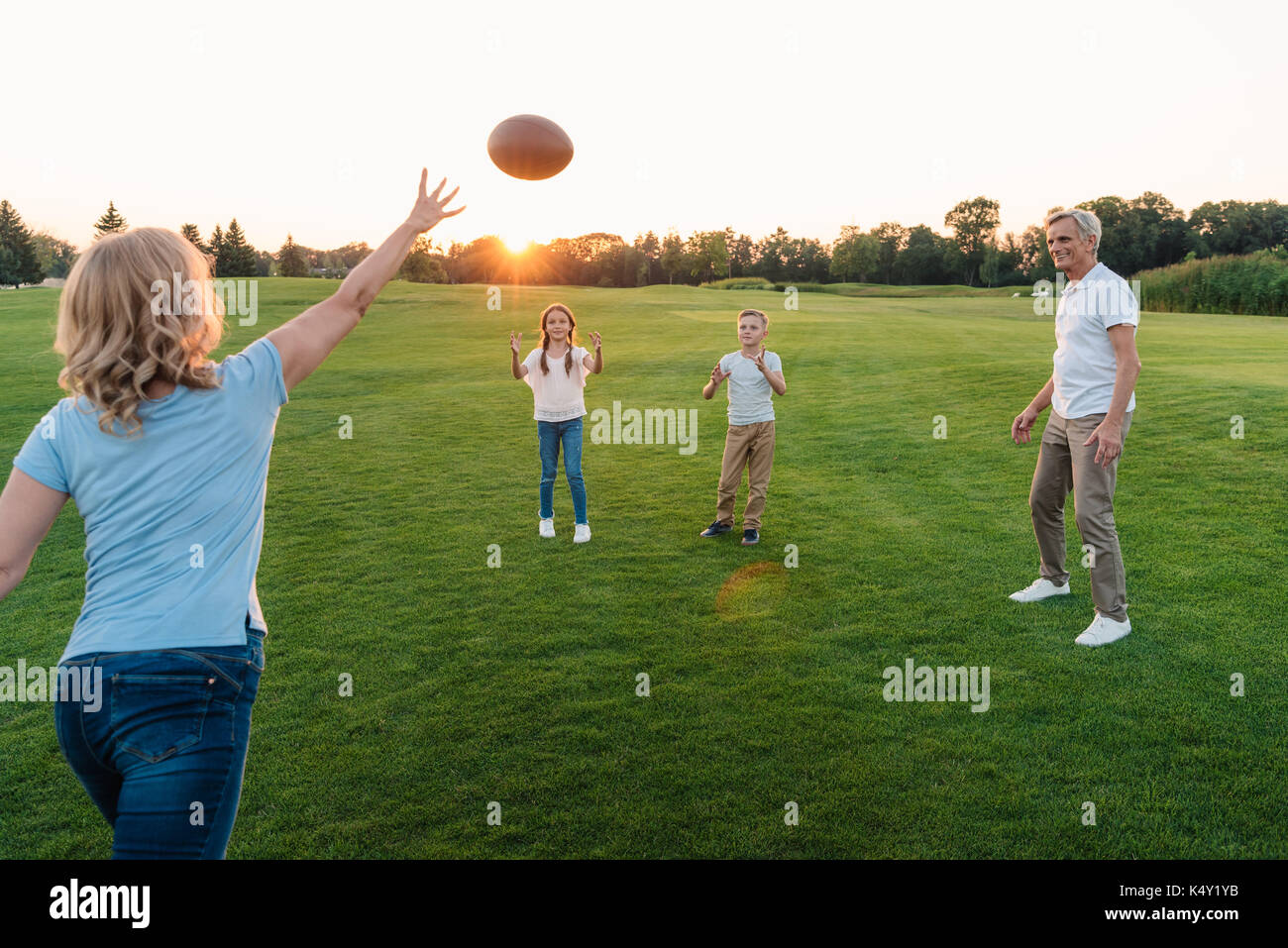 family playing american football Stock Photo - Alamy