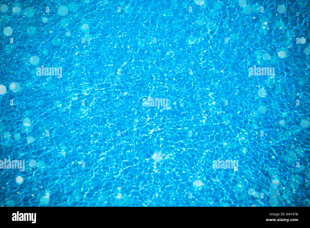 Clear transparent pool water background. Sun reflections in pool water ...