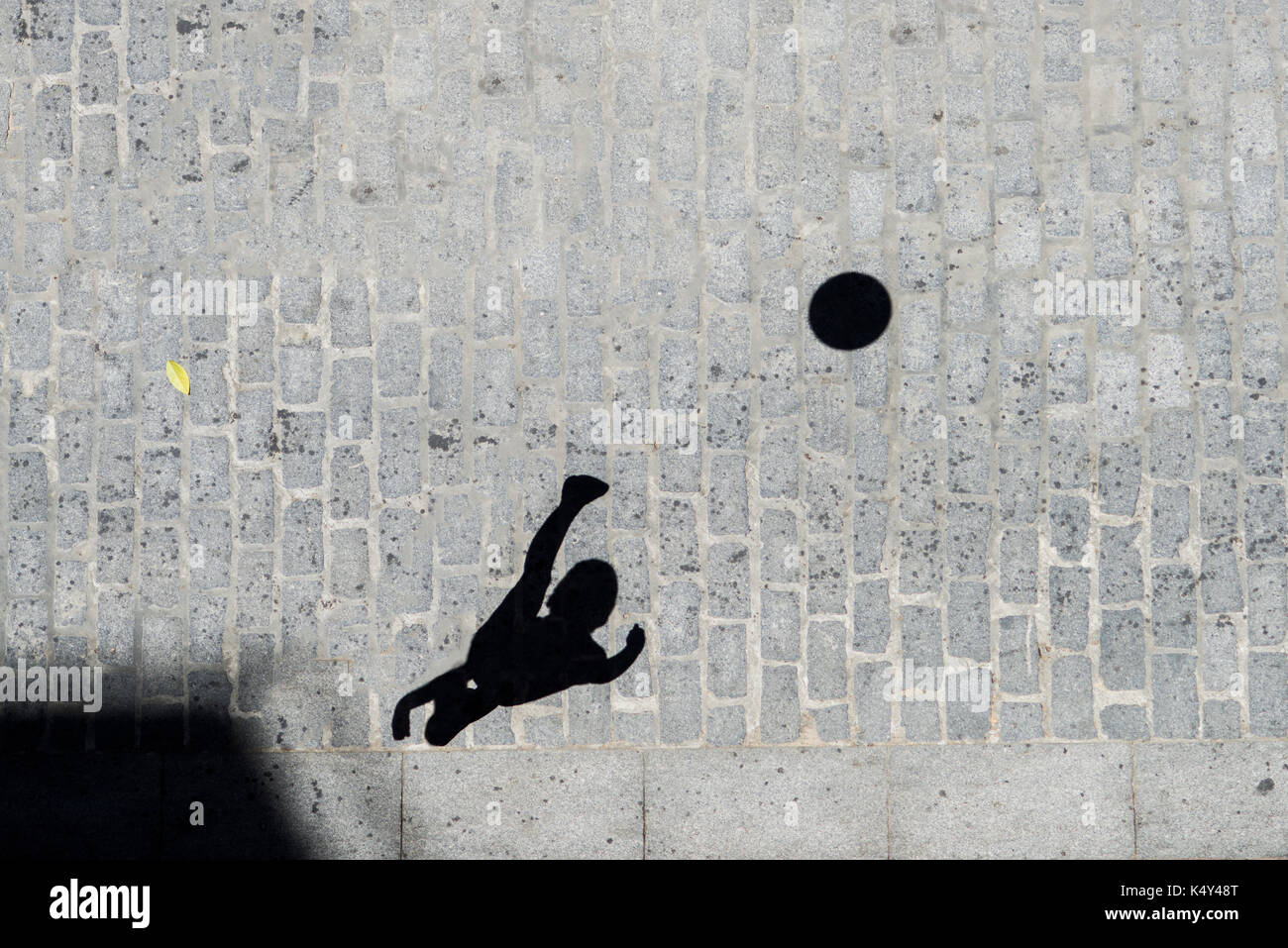 Silhouette boy kicking soccer ball hi-res stock photography and images ...