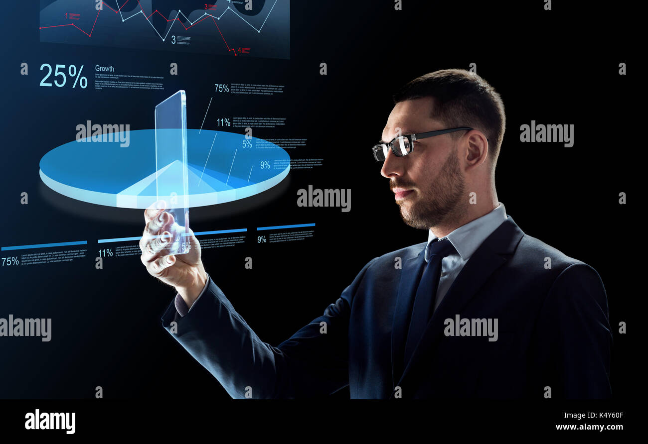 businessman with tablet pc and virtual charts Stock Photo - Alamy
