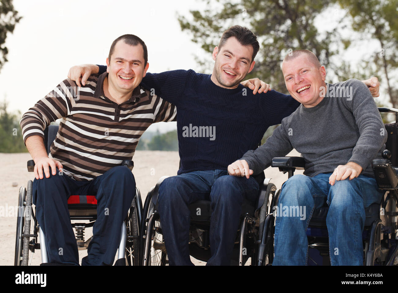 Disabled happy friends having fun together outside Stock Photo - Alamy