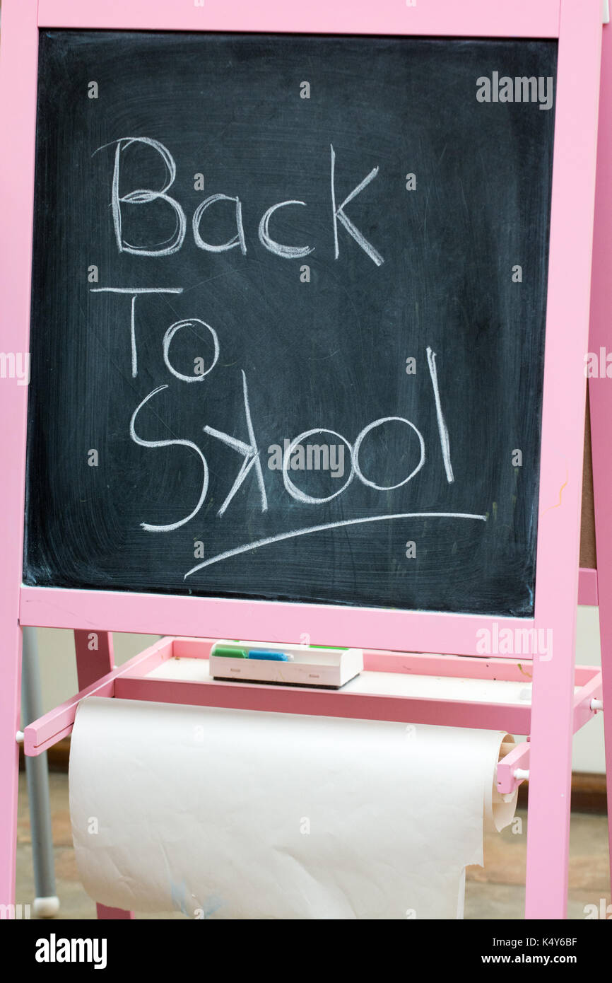 Back to school text hand written on a chalk board Stock Photo - Alamy