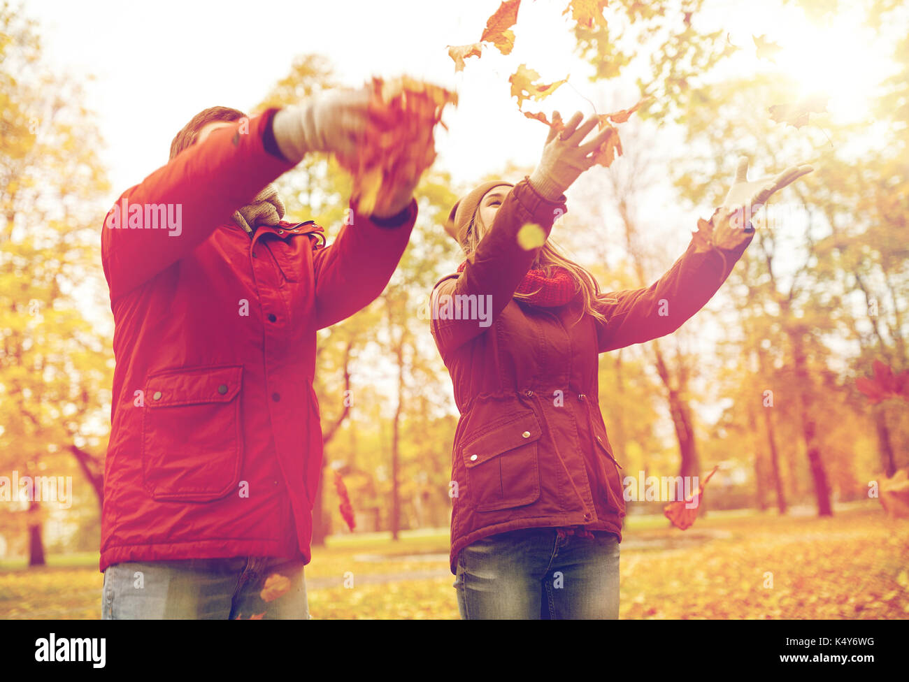 Couple playing with leaves at park hi-res stock photography and images ...