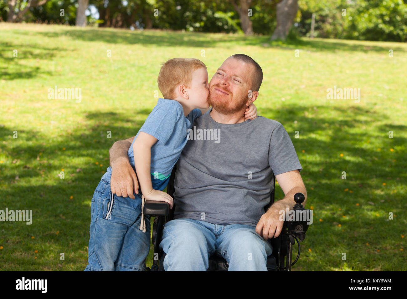 Disabled father with his little son Stock Photo - Alamy